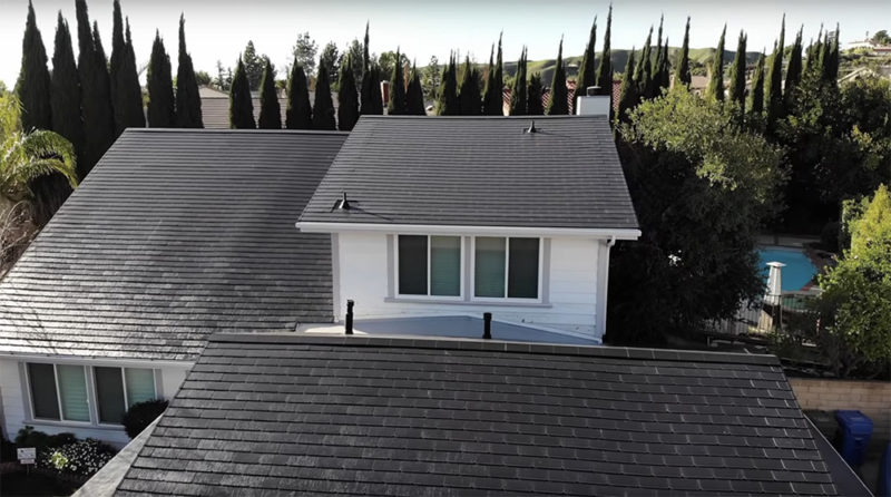 Tesla solar shingles power a home — and an electric car ...